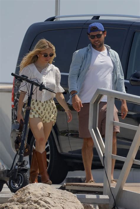 Sydney Sweeney Floral Shorts And Cowboy Boots In Mallorca August 14