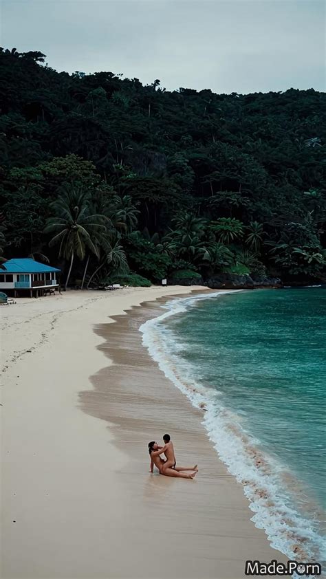 A Tranquil Sunny Beach Scene With White Sand Palm Trees And Clear