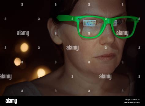 Low Key Portrait Of Busy Woman Working On Laptop Computer At Night From