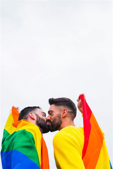 Free Photo Homosexual Couple Kissing Covered With Lgbt Flags