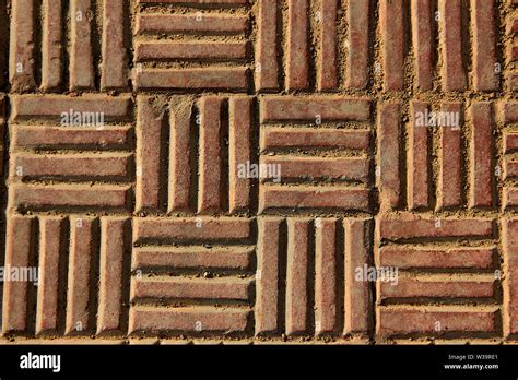 Top View Of Pattern Of Grooved And Ridged Brown Colored Flooring Tiles