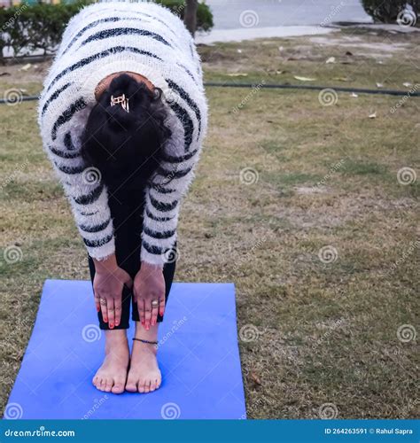 Portrait Of Gorgeous Young Indian Woman Practicing Yoga Outdoor In A
