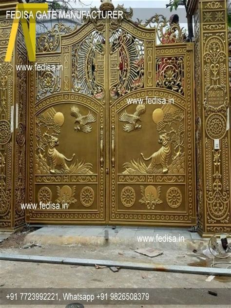 An Ornate Gold Gate With Two Birds On It