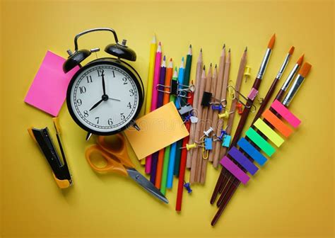 Alarm Clock And School Stationary On Yellow Background Stock Image Image Of Stationary Stick
