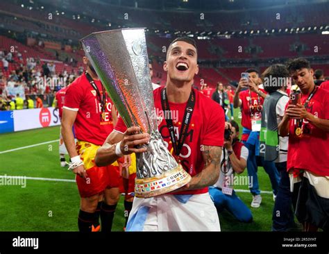 Sevillas Erik Lamela Celebrates With The Uefa Europa League Trophy