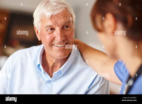 Theyre Taking Good Care Of Him Here A Female Nurse Checking On Her