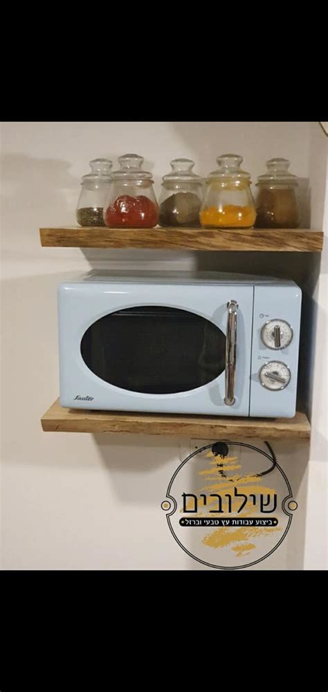 Gilad Shefer מדפי עץ טבעי שילובים עץ וברזל