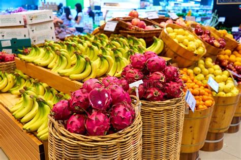 A Large Assortment Of Ripe Juicy Colored Fruits In An Asian