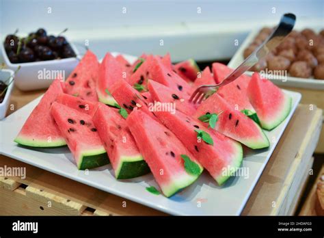 Closeup Shot Of Sliced Watermelon On A Plate Served On A Buffet Table
