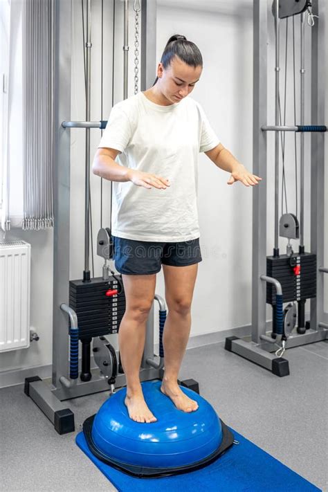 Balance Exercise With Bosu Ball Woman And In A Gym Stock Image