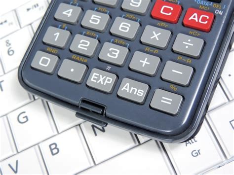 Premium Photo High Angle View Of Calculator On Computer Keyboard