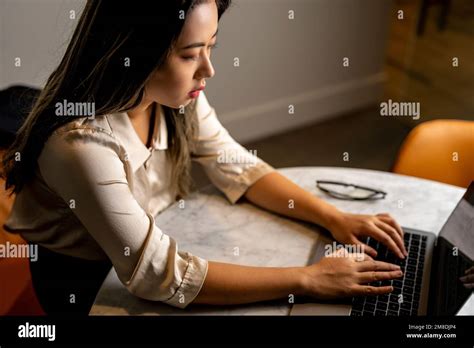 Business Woman Top Down Software Engineer Working On Laptop In Conference Room Stock Photo