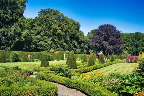 Formal French Garden With Topiary Flower Beds Hedges Lawns And Tall