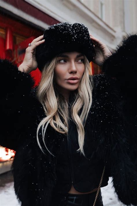 Beautiful Woman With Blond Hair Wearing Elegant Fur Coat And Hat In