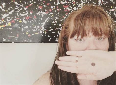 Why People Are Posting Photos Of Black Dots On Their Hands Yourtango