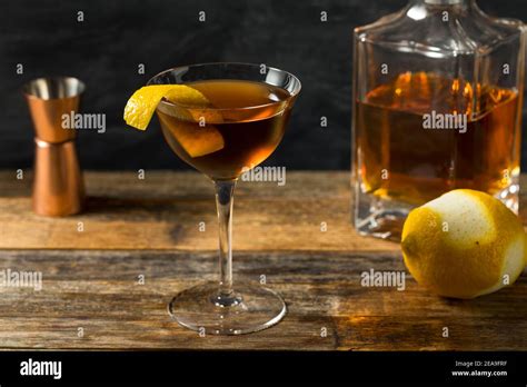 Boozy Alcoholic Scotch Bobby Burns Cocktail With A Lemon Peel Stock Photo Alamy