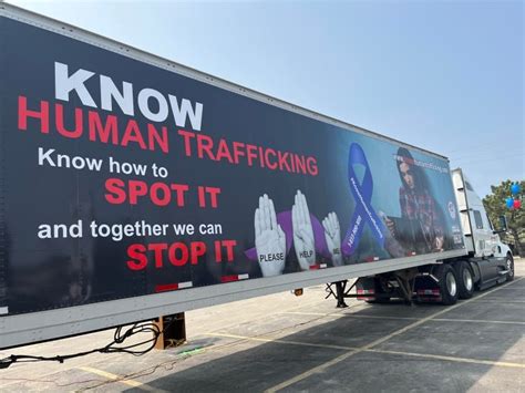 Women Truckers Roll Out Rig Showing Help Me Hand Signals To Stop