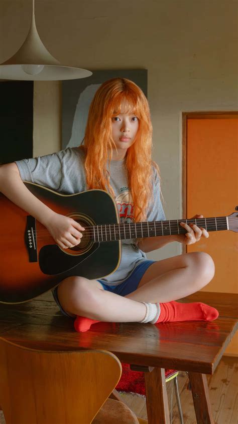 Download Orange Haired Girl Playing Guitar Wallpaper