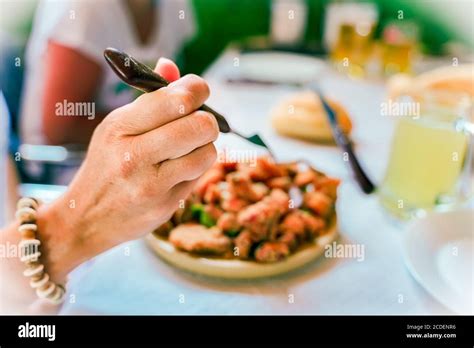 Hand Holding A Fork A Female Hand Is Trying To Use Fork To Eat Focus On Hand And Fork Image