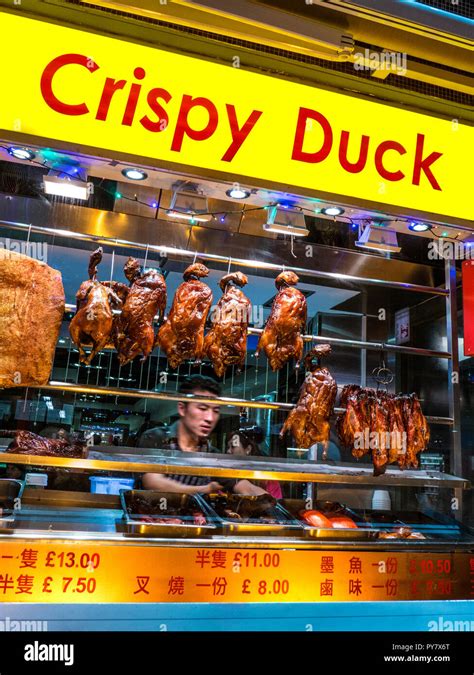 Crispy Duck Window Display Chinatown Chef Arranging Duck And Pork Hanging