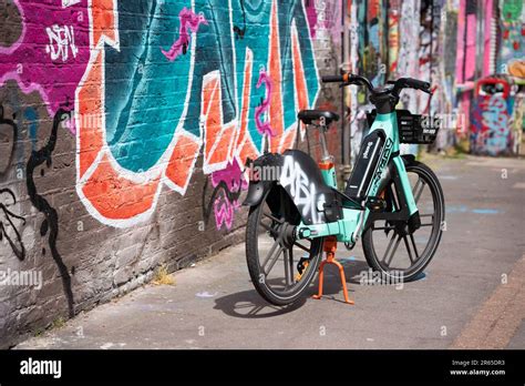 Graffiti on a wall with eco bicycle in London, England, UK Stock Photo ...