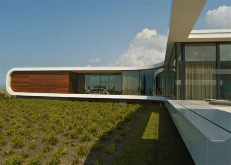 Corian Facade Wraps Around Waterside Dutch Home