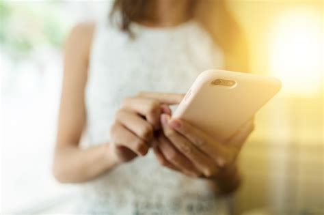 Premium Photo Woman Using Mobile Phone