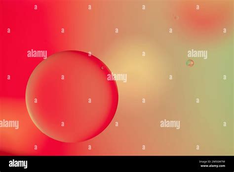 Colourful Light Diffraction Patterns Formed By Oil Droplets Floating On