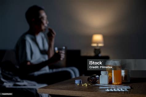 Depressed Senior Asian Man Sitting In Bed Cannot Sleep From Insomnia