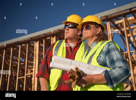 Male And Female Construction Workers At Construction Site Stock Photo Alamy