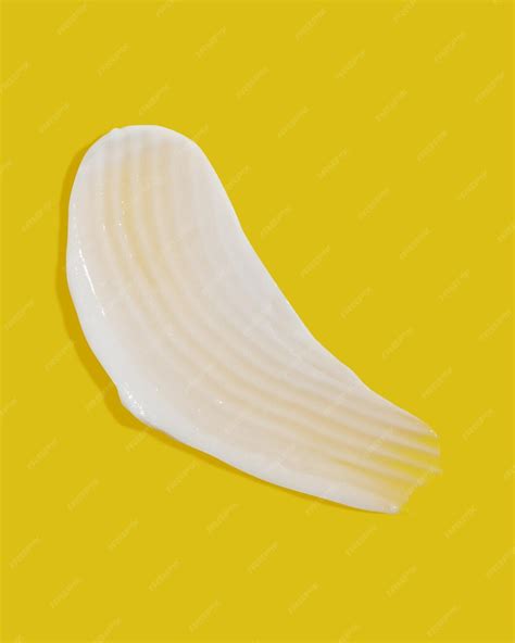 Premium Photo White Beauty Cream Smear Smudge On Yellow Background