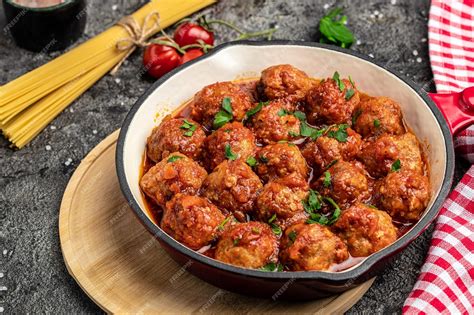 Premium Photo Traditional Spicy Meatballs In Sweet And Sour Tomato