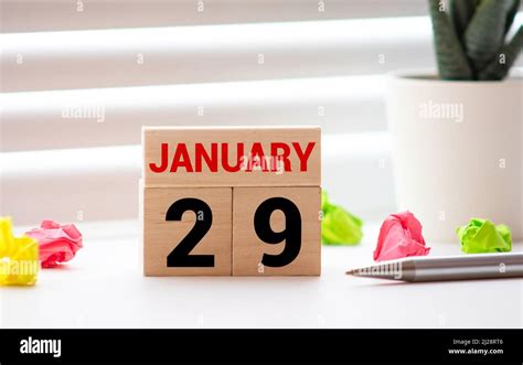 Cube Shape Calendar For January 29 On Wooden Surface With Empty Space