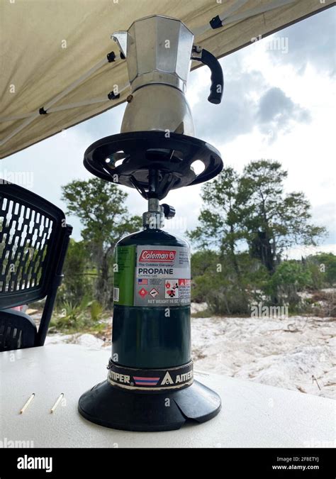 Heating Up Espresso Coffee In A Cuban Coffee Maker Using A Mini Gas
