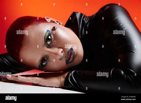 The Young Woman Flaunts Her Bold Colorful Style With Pink Hair