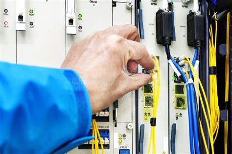 Man Connecting Network Cables To Switches In The Computer Room Stock Image Image Of Connection