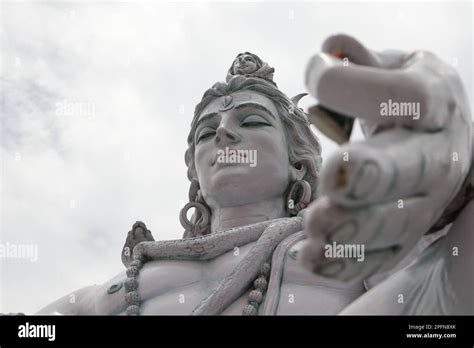 Statue Of Lord Shiva Hindu Idol Near Ganges River Water Rishikesh