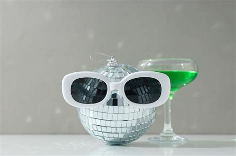 Premium Photo A Beautiful Disco Ball With Glasses And A Cocktail