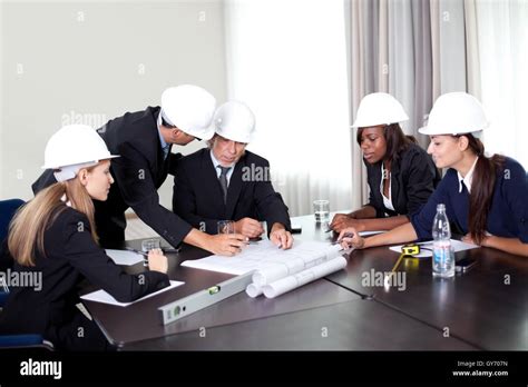 Successful Group Of Architects Discussing Stock Photo Alamy