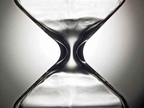 Premium Photo Close Up Of Hourglass Glass Against White Background
