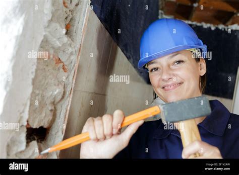 Woman With Hammer And Chisel Stock Photo Alamy