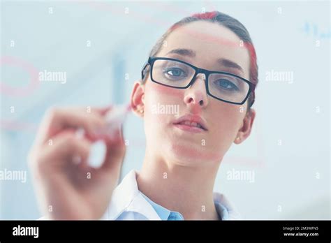 Making One Last Adjustment Closeup Of A Focused Young Female Scientist Doing Calculations And