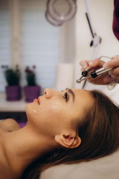 Premium Photo Beautiful Woman Receiving Facial Microcurrent Procedure
