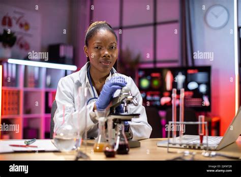 Modern Medical Research Laboratory Portrait Of African Scientist Working Using Microscope