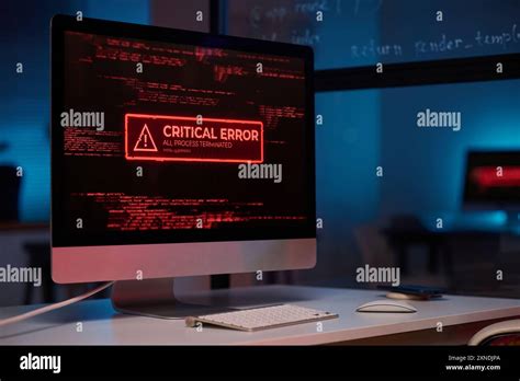 Background Image Of Pc Computer With Emergency Message Of Critical Error On Screen In Red Lights