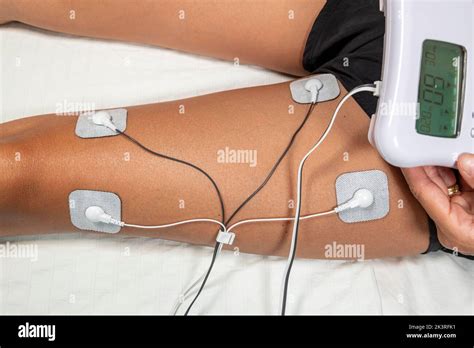 Woman In The 40s Using Tens Transcutaneous Electrical Nerve