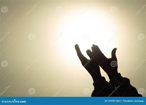 Silhouette Of Young Human Hands Open Palm Up Worship And Praying To God