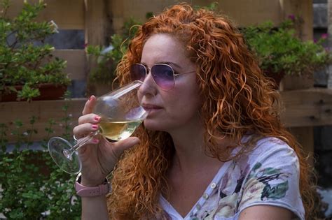 Premium Photo Redhead Woman Drinking Glass Of Wine