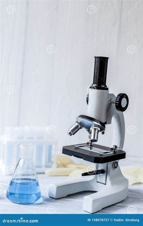Beaker With Liquid On Background Microscope Stock Image Image Of Lens