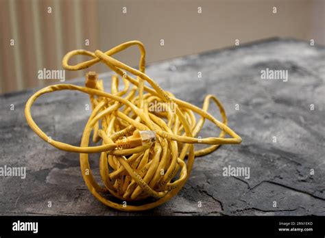 Long Yellow Ethernet Cable For Computing Networking In A Bit Of A